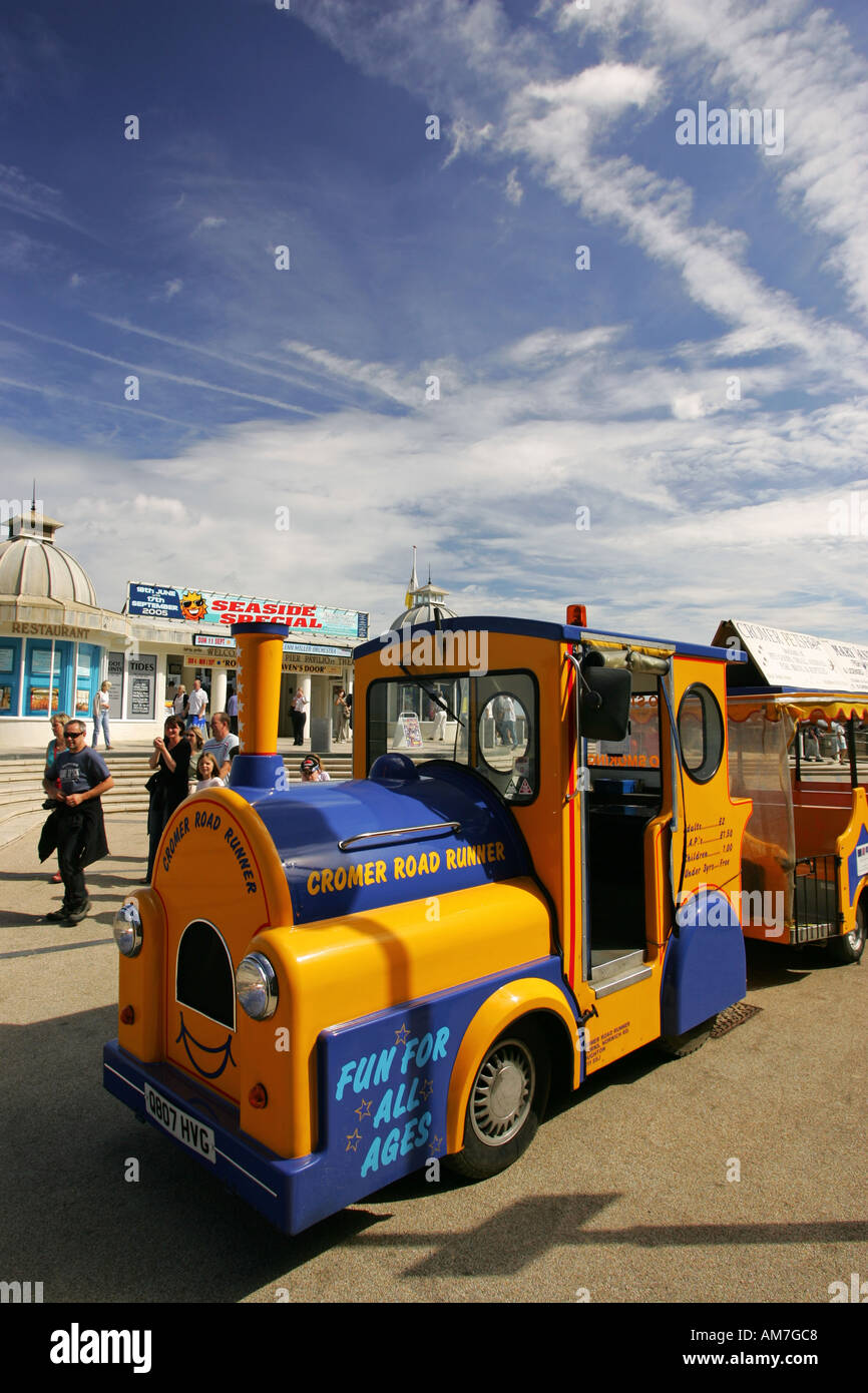 Novelty bright yellow road train waits for tourist passengers on the ...