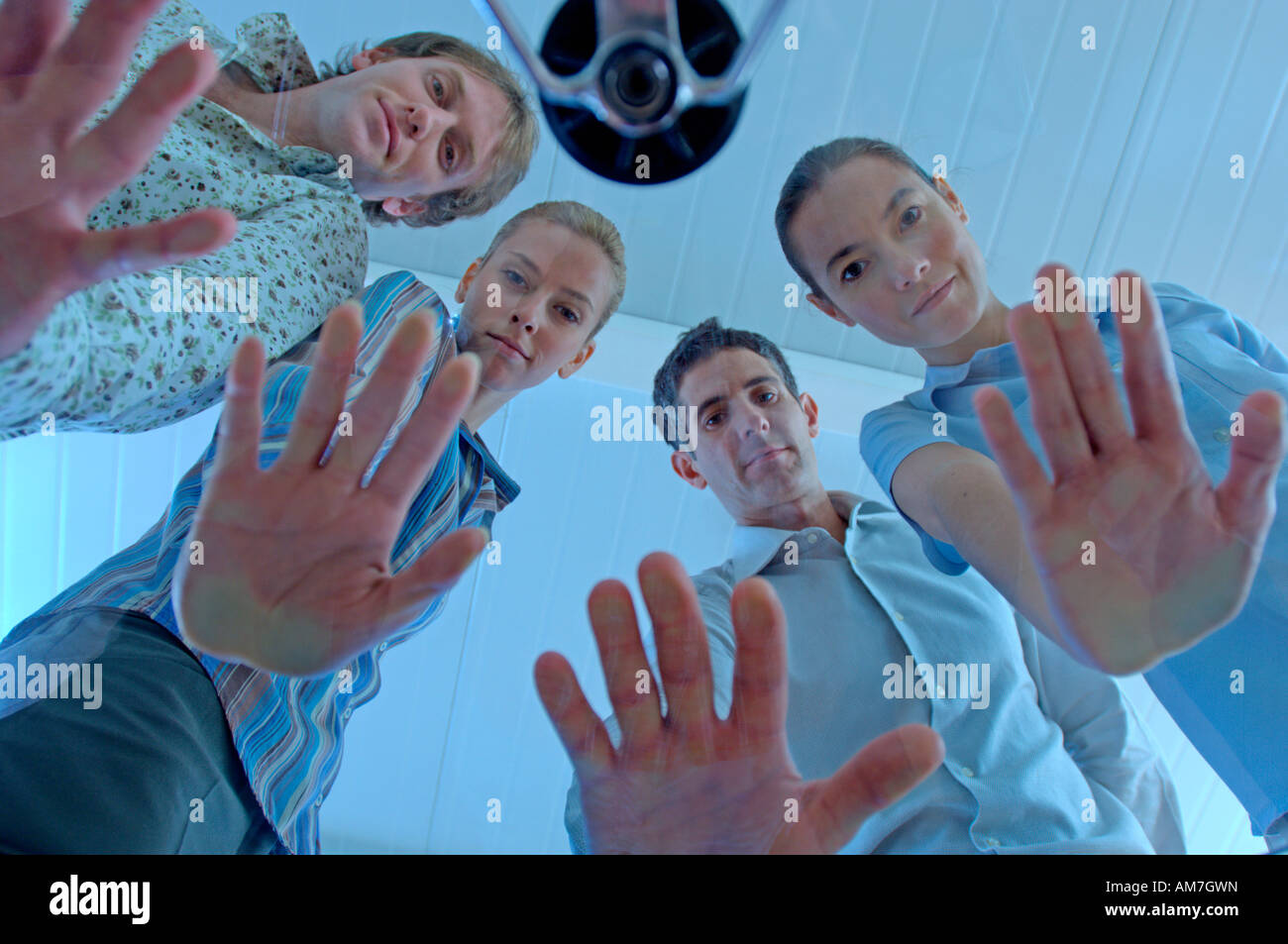 Business people showing hands, low angle view Stock Photo - Alamy
