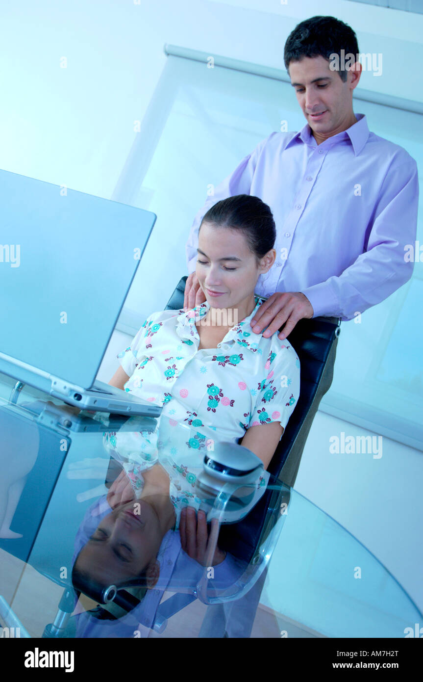 Businessman massaging businesswoman hi-res stock photography and images ...