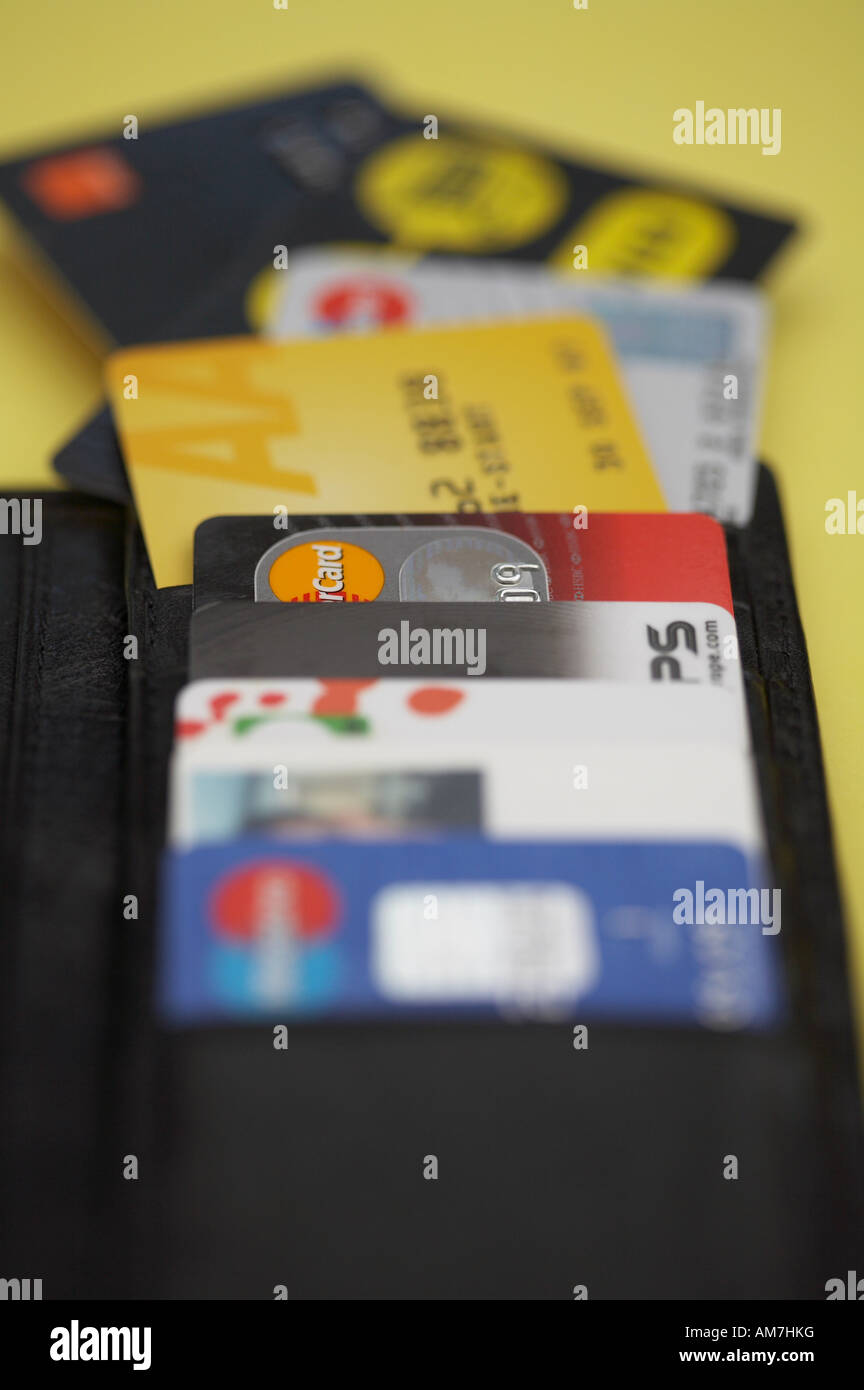 Close-up of open wallet with credit/debit cards spilling out Stock ...