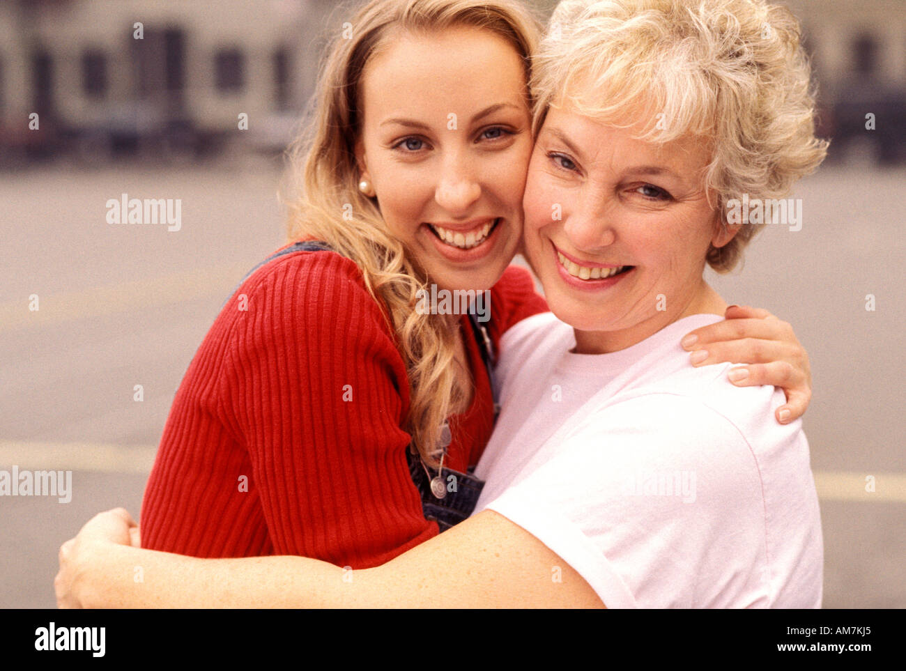 Mother embracing her daughter, portrait Stock Photo - Alamy Mother embracing her daughter, portrait Stock Photo - Alamy