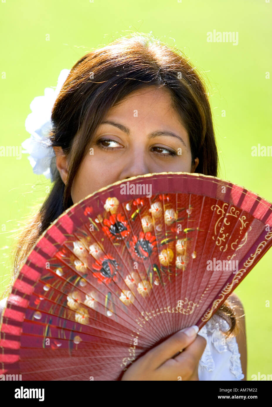 Young Spanish girl or woman holding traditional fan Stock Photo - Alamy
