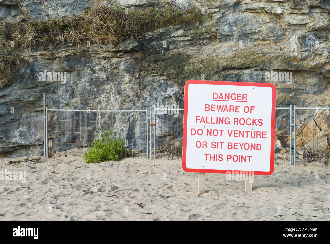Sign Warning of the Dangers from Rockfall Stock Photo - Alamy