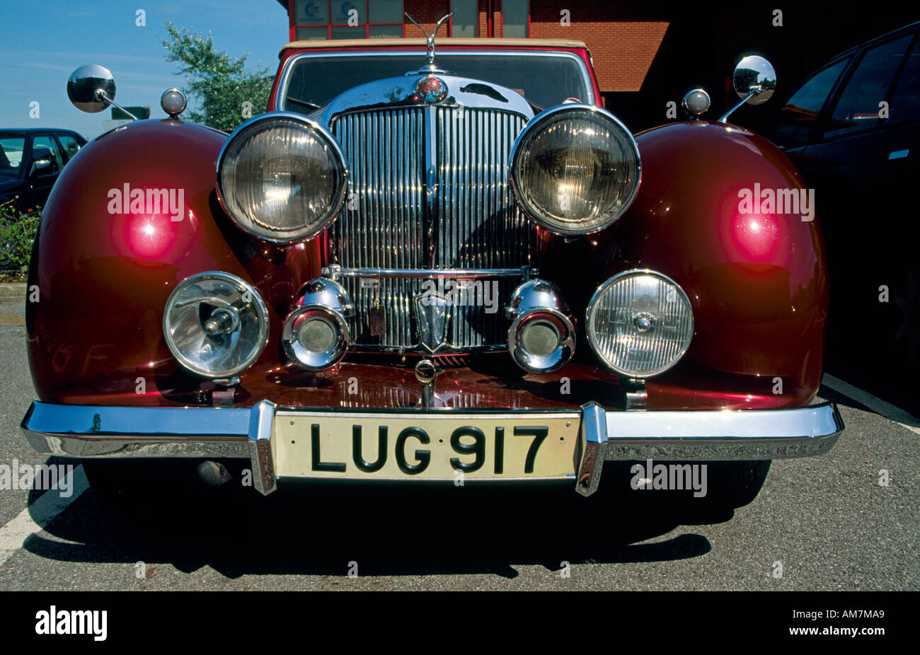 Classic old car with lots of headlamps from below Stock Photo - Alamy
