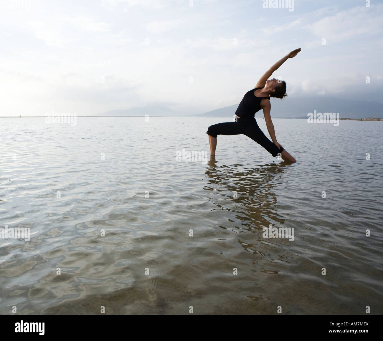 Woman practising hatha yoga hi-res stock photography and images - Alamy