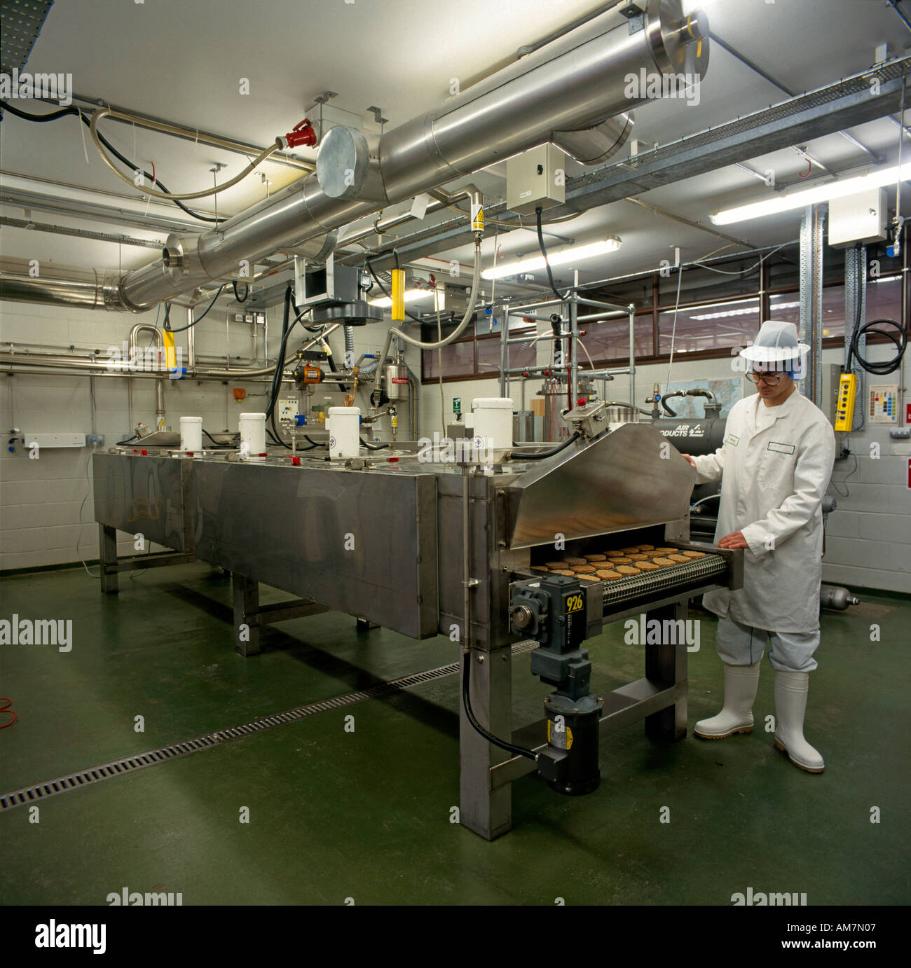Technician worker in white overalls and headwear with 1990s Cryogenic ...