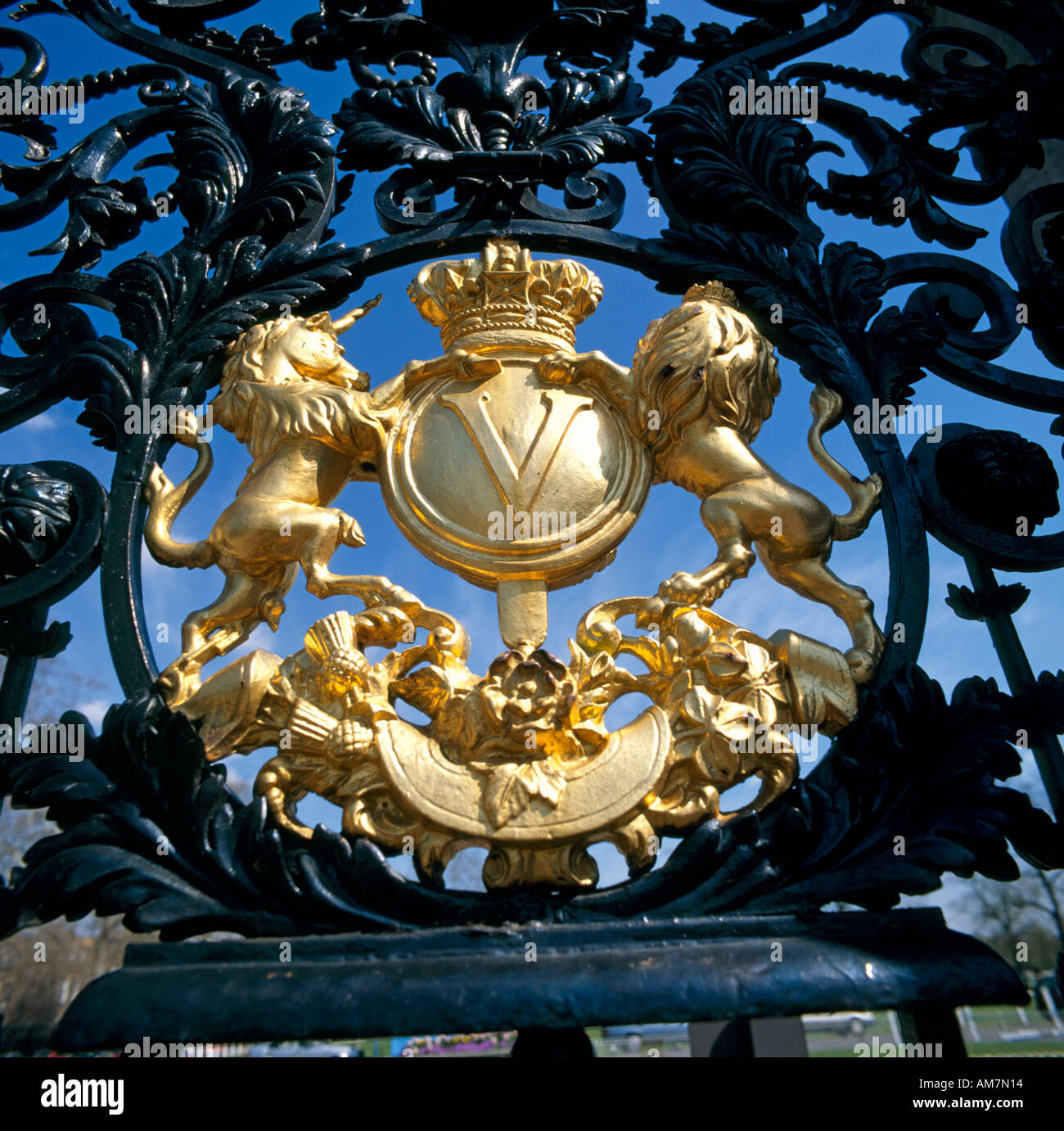 Golden emblem of Queen Victoria on gates of Kew Gardens Richmond London ...