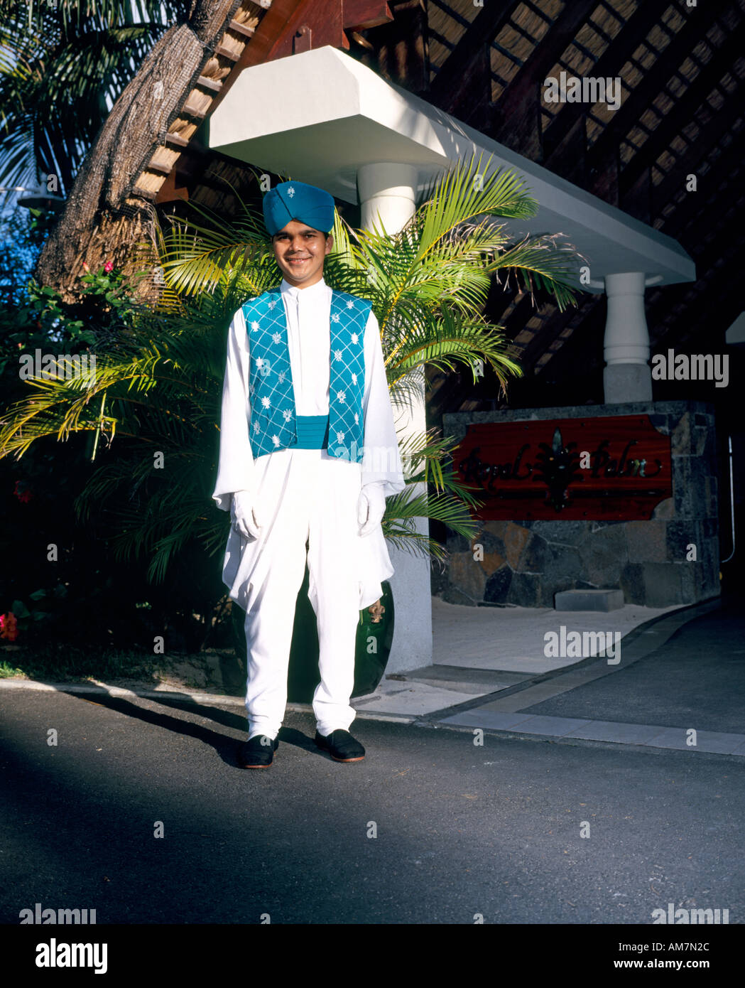 Doorman of exotic Royal Palm Hotel in tropical uniform Mauritius Stock ...
