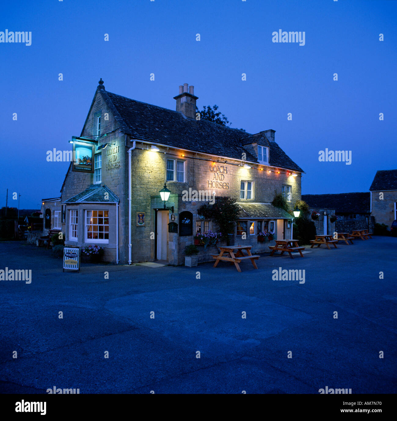 Coach and horses pub at dusk Stock Photo - Alamy