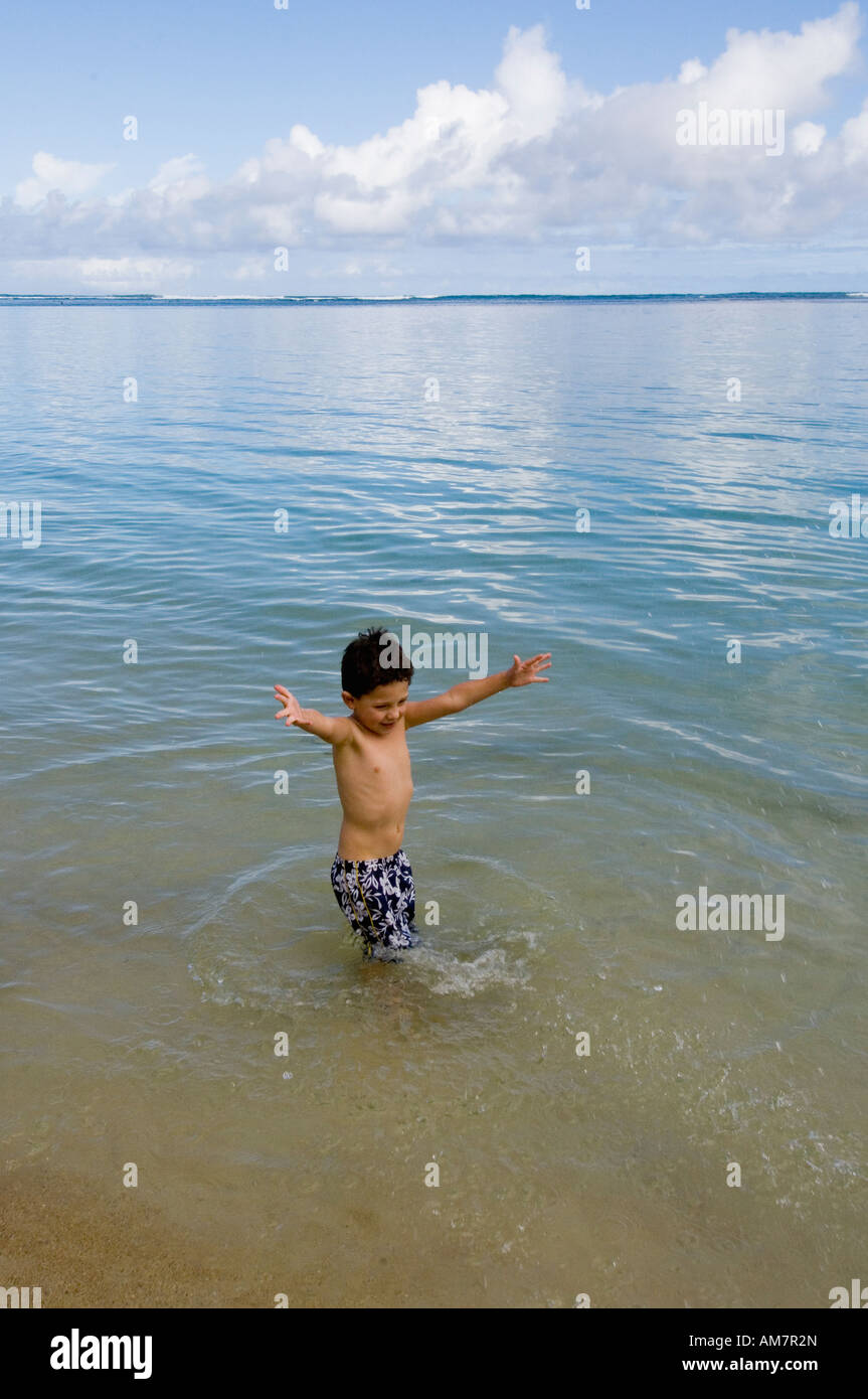 Boy aged 4 playing in ocean, Hawaii MODEL RELEASED Stock Photo - Alamy