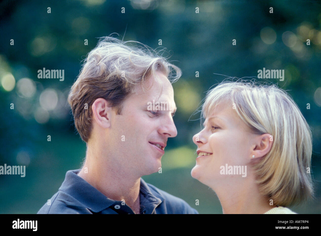 Mid adult couple smiling Stock Photo - Alamy