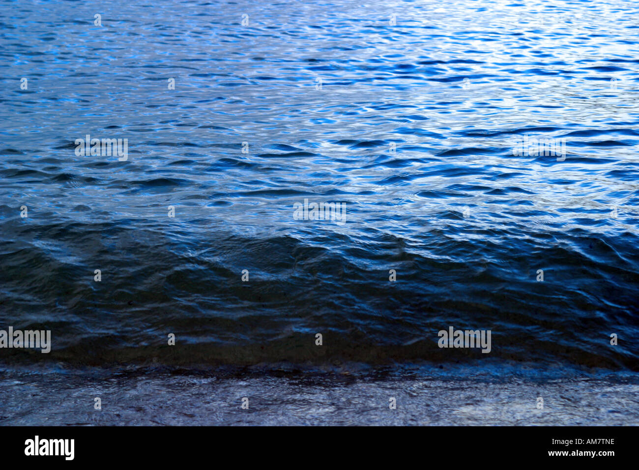 Sun reflecting in the ocean surface Stock Photo - Alamy