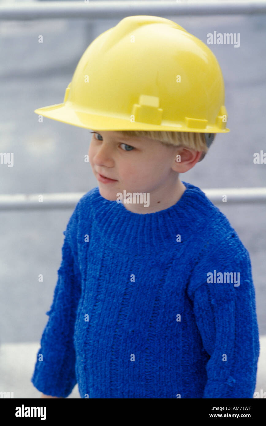 Boy [6, 7] wearing yellow hat Stock Photo - Alamy