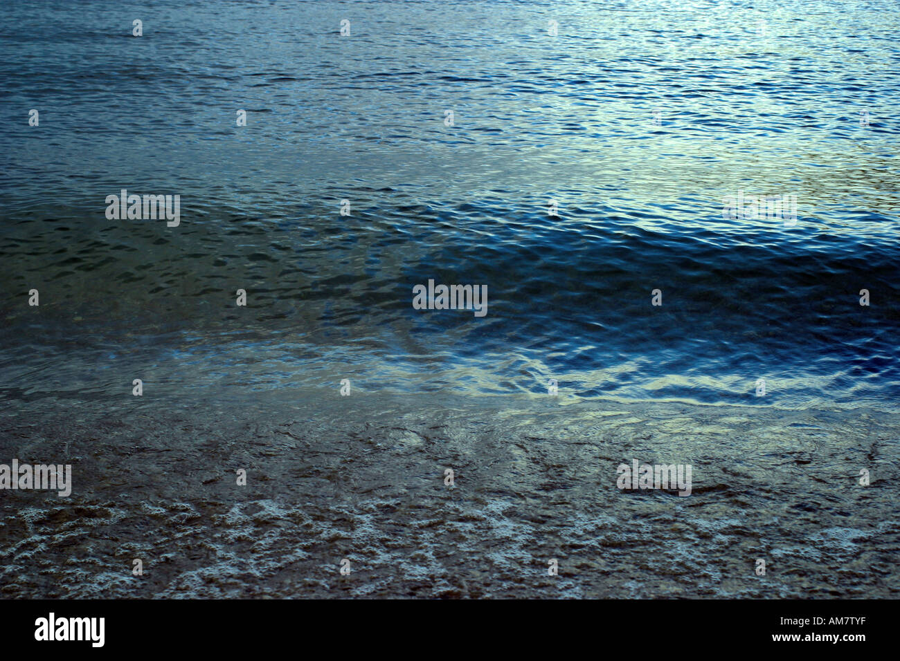 Sun reflecting in the ocean surface Stock Photo - Alamy