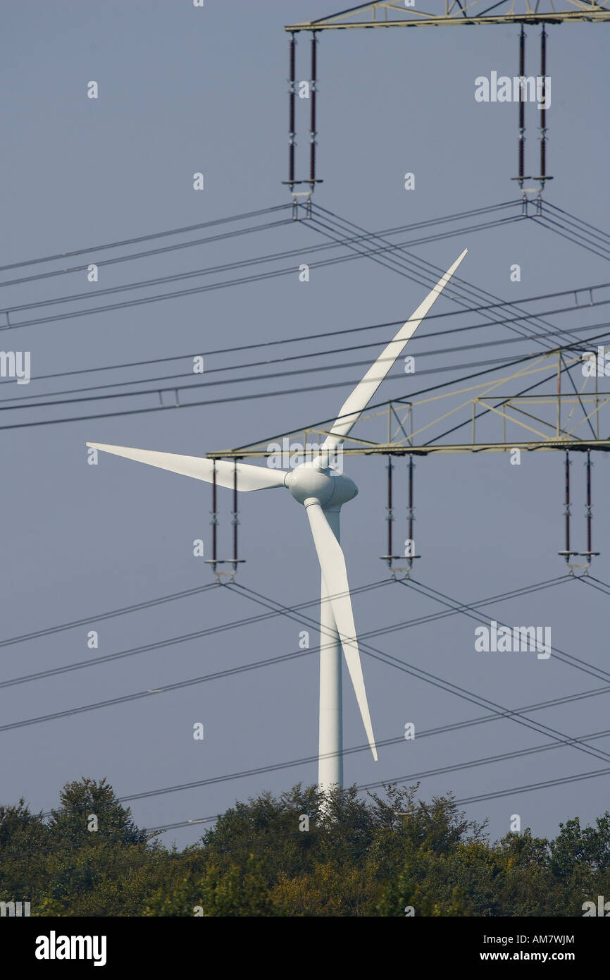 Wind energy plant and a pylon Stock Photo - Alamy