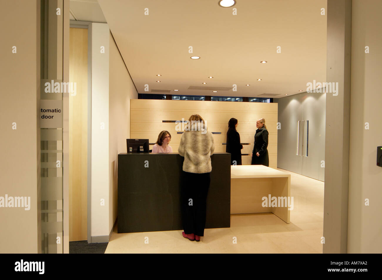 People in Office Reception Stock Photo - Alamy