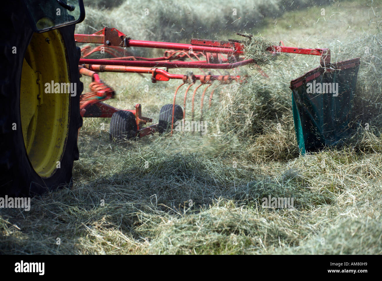 Tractor turning hay on field hi-res stock photography and images - Alamy