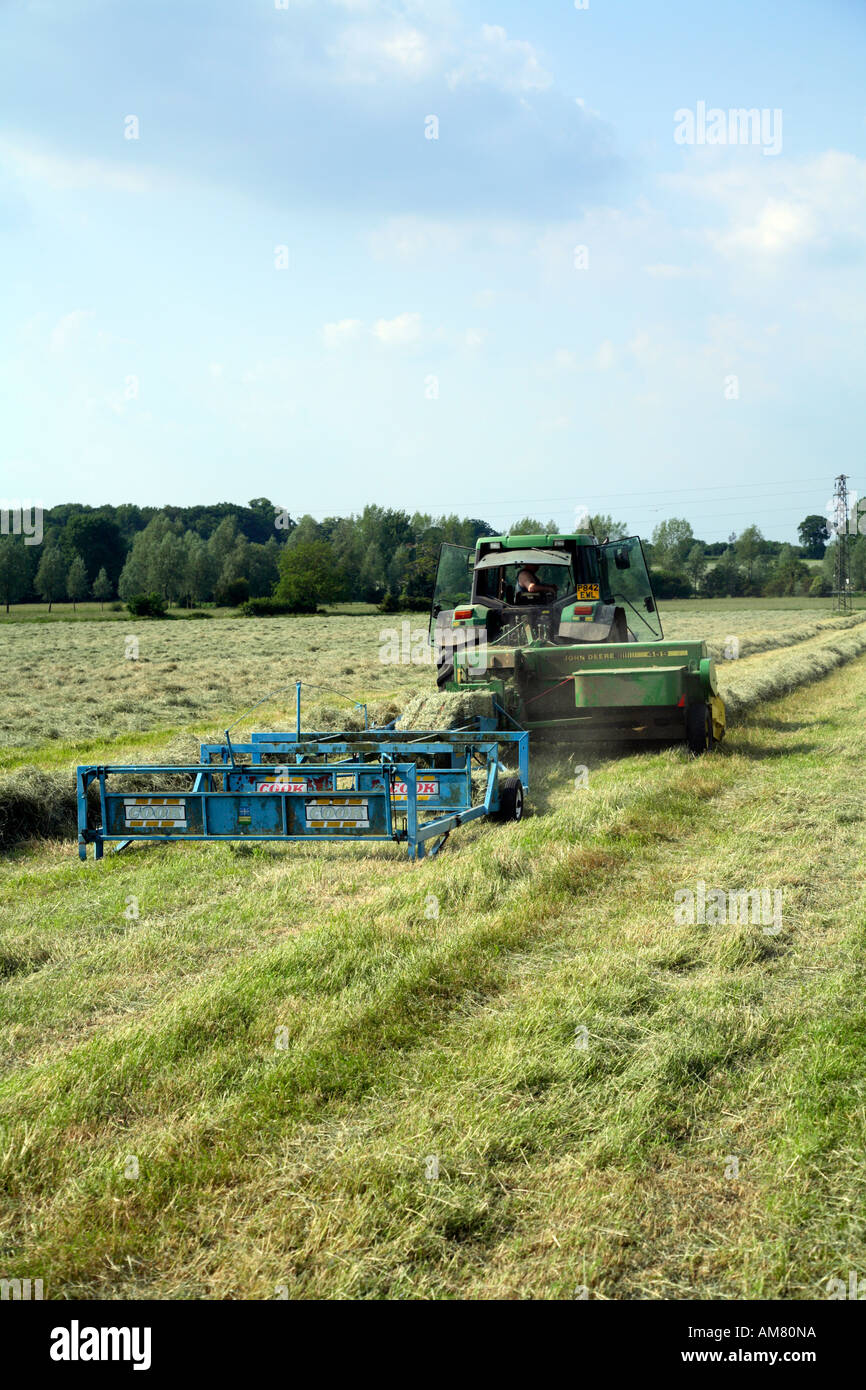 Farmer baling summer hay 21 Stock Photo - Alamy