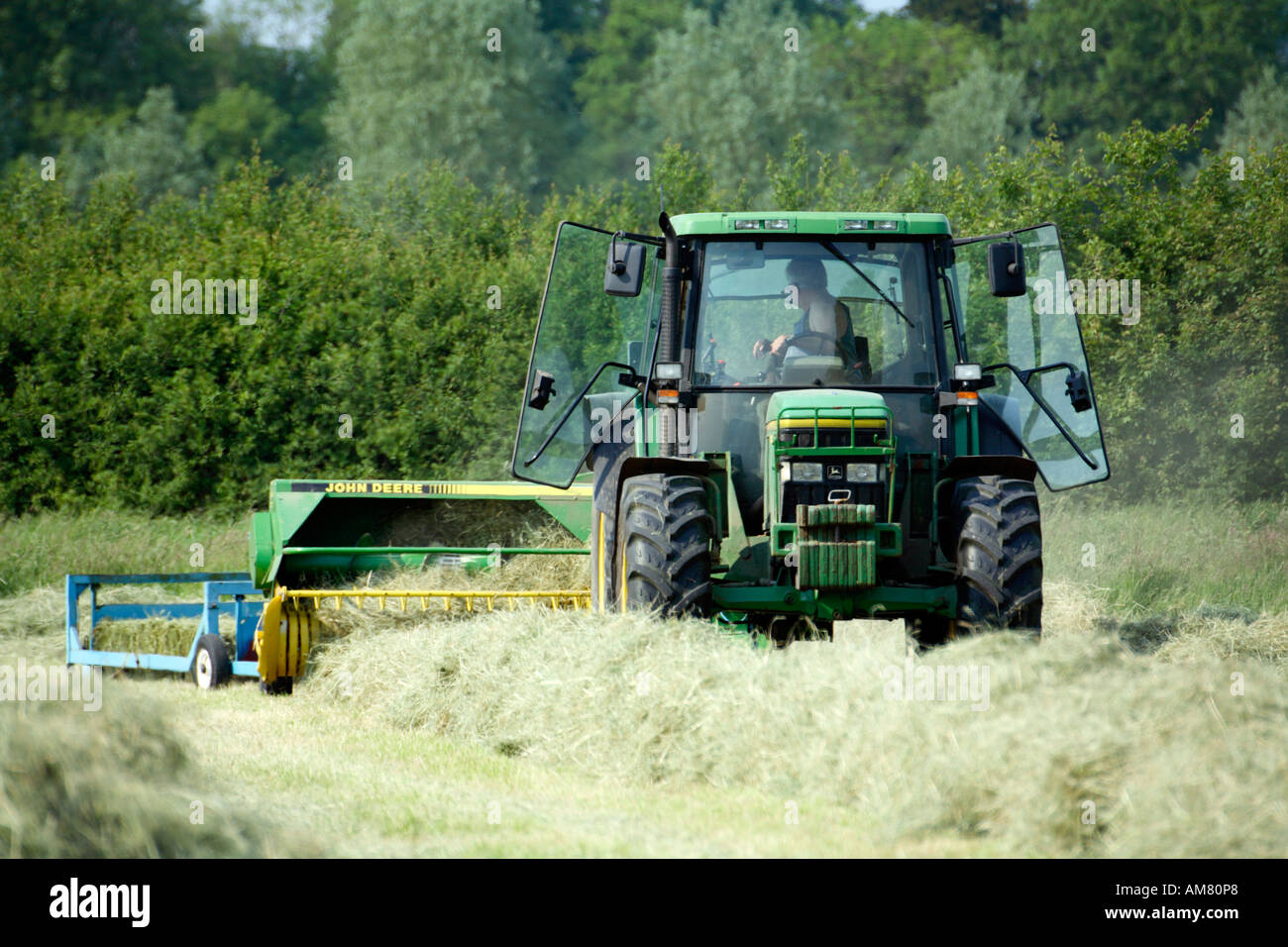Farmer baling summer hay 7 Stock Photo - Alamy