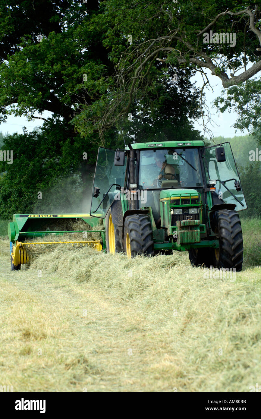 Farmer driving hay baler hi-res stock photography and images - Alamy