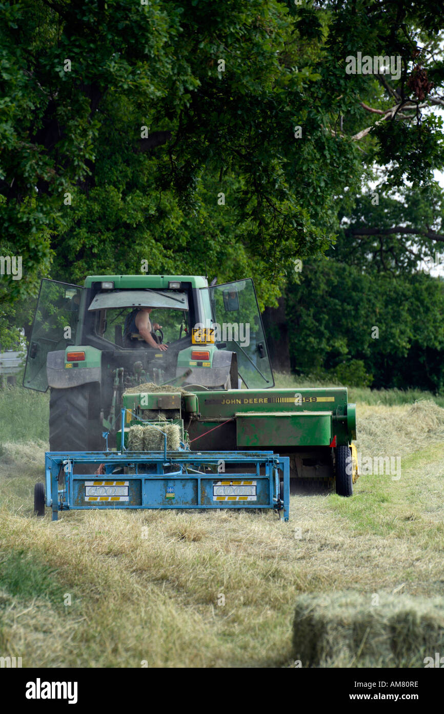 Farmer driving hay baler hi-res stock photography and images - Alamy