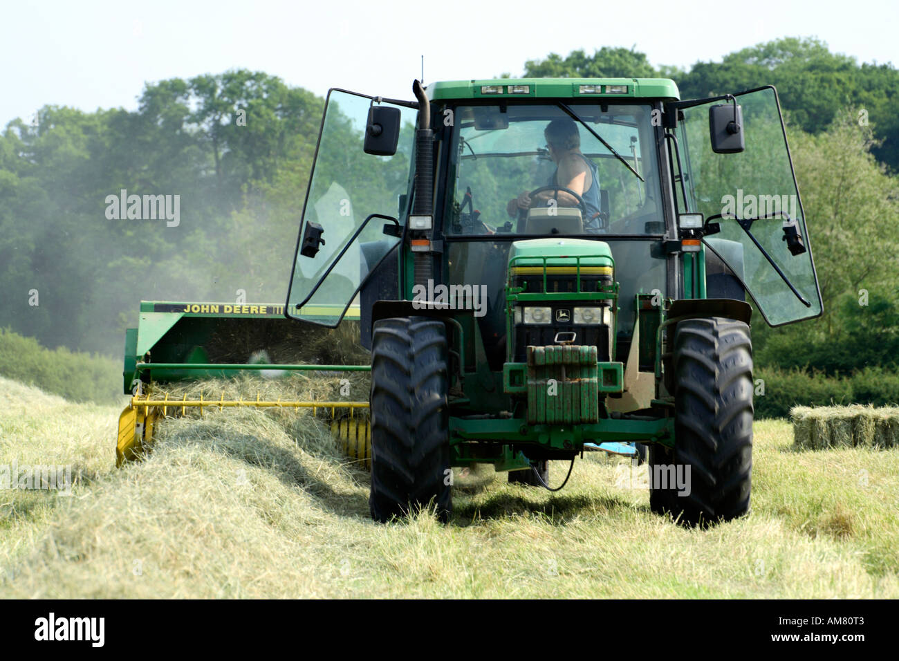 Farmer baling summer hay 10 Stock Photo - Alamy