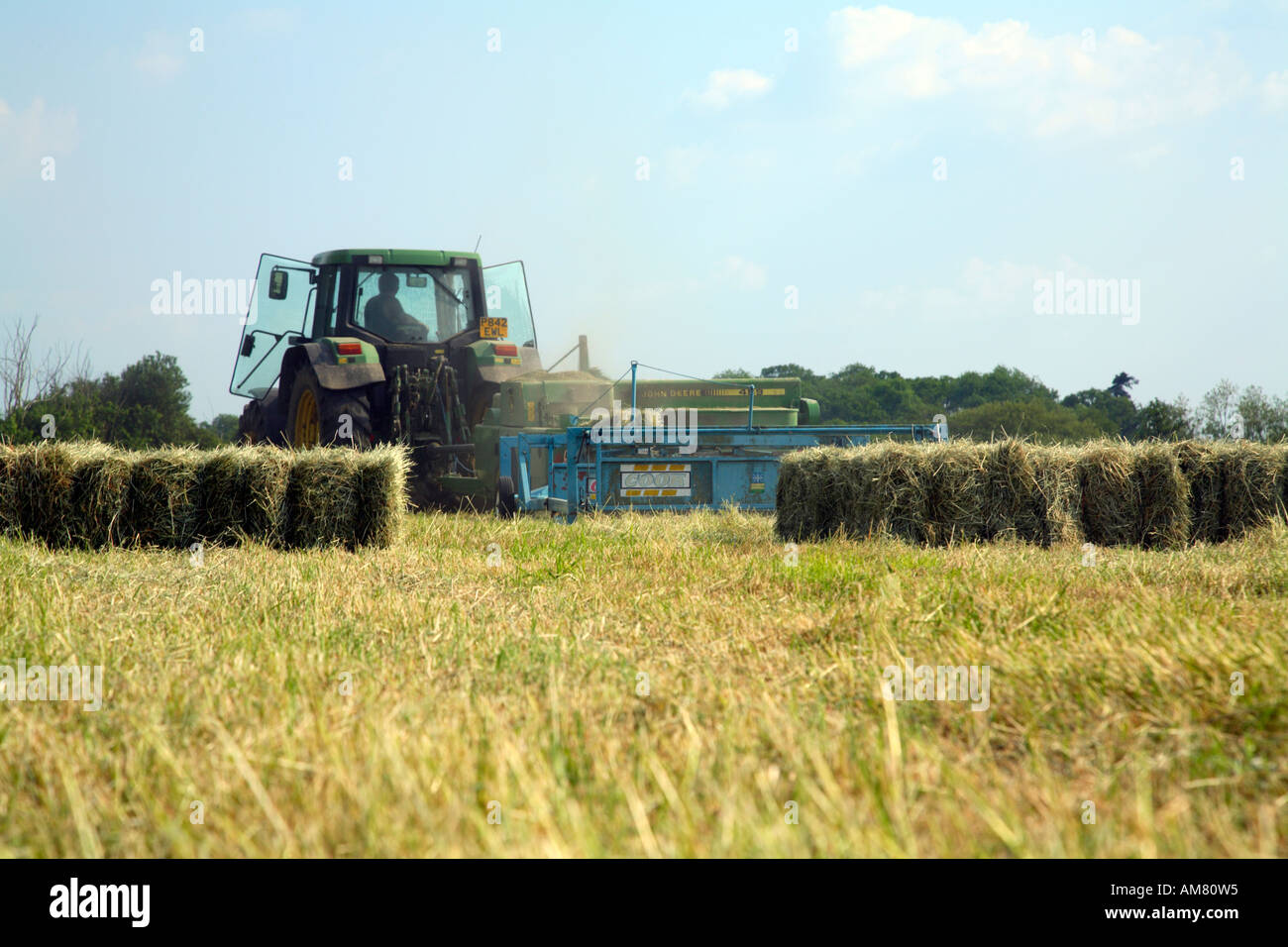 Farmer baling summer hay 11 Stock Photo - Alamy