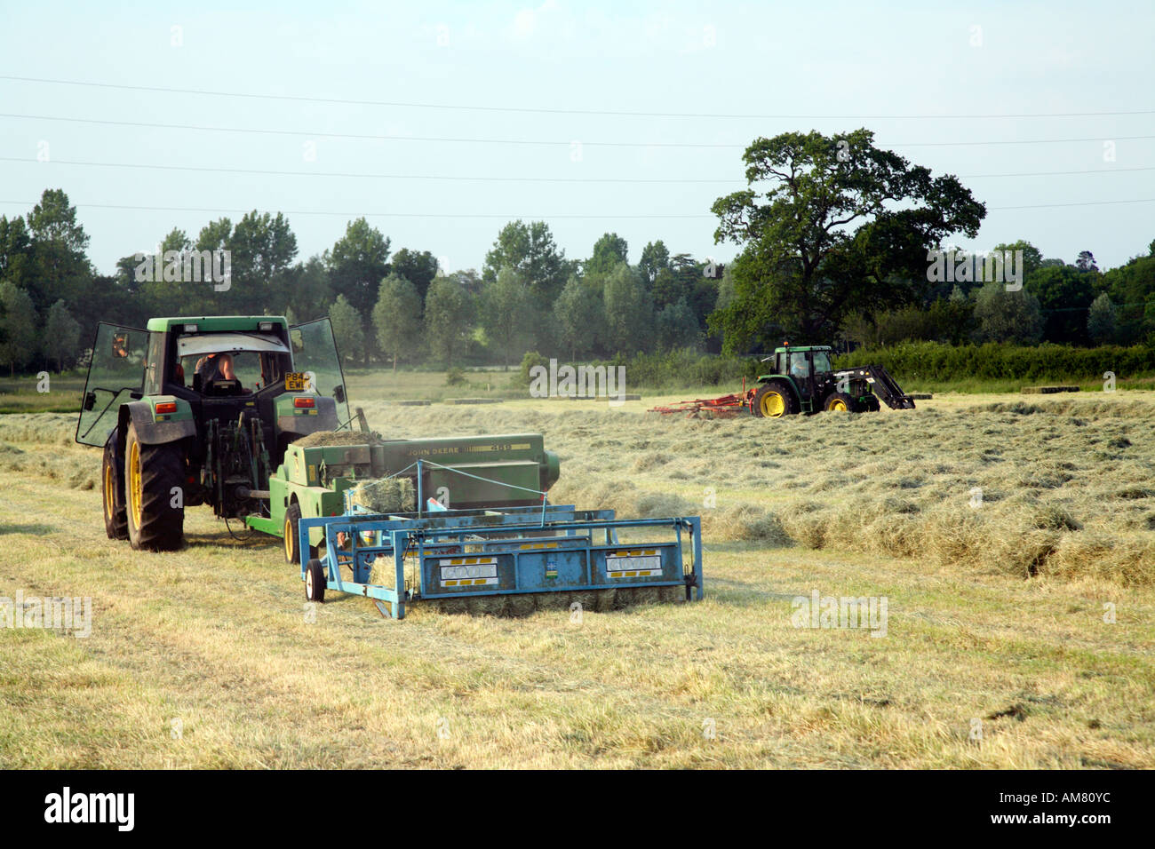 Farmer baling summer hay 16 Stock Photo - Alamy