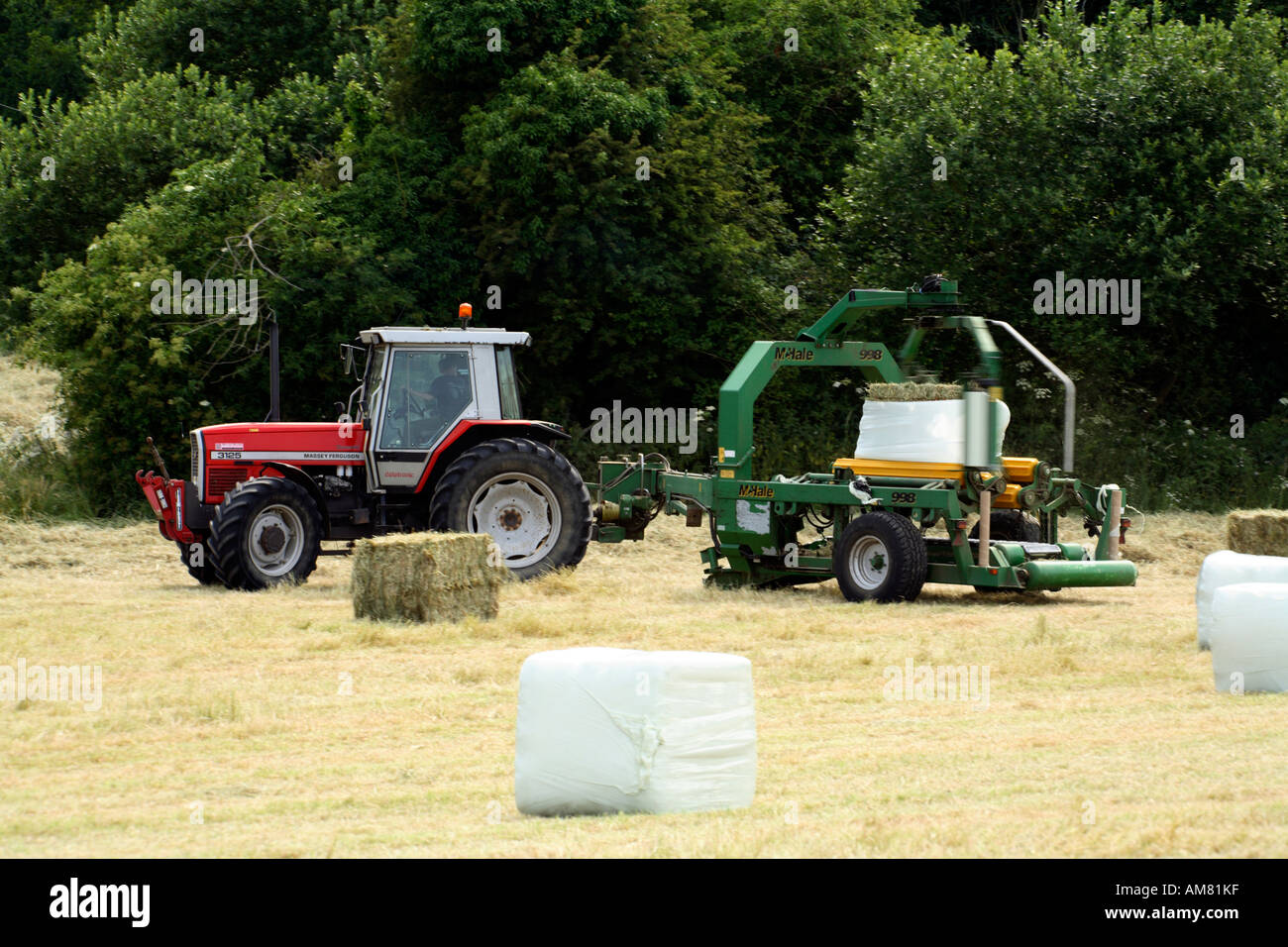 Hay bale wrapping machine hi-res stock photography and images - Alamy