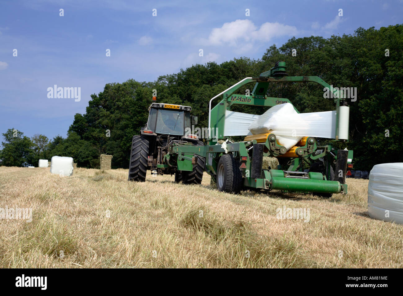 Hay bale wrapping machine hi-res stock photography and images - Alamy