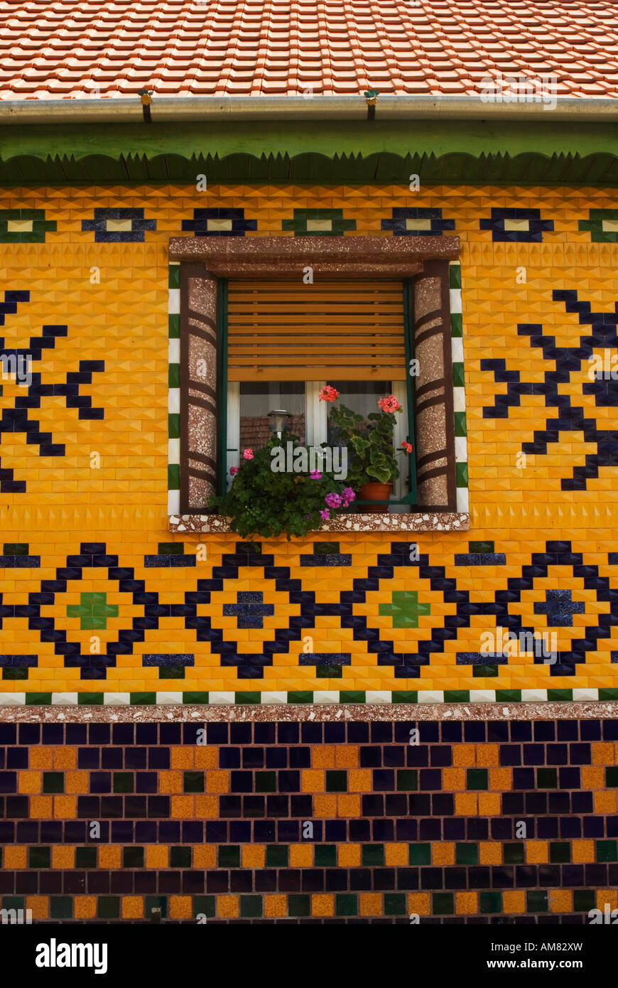 Traditional house decorated in tiles. Romania Stock Photo - Alamy
