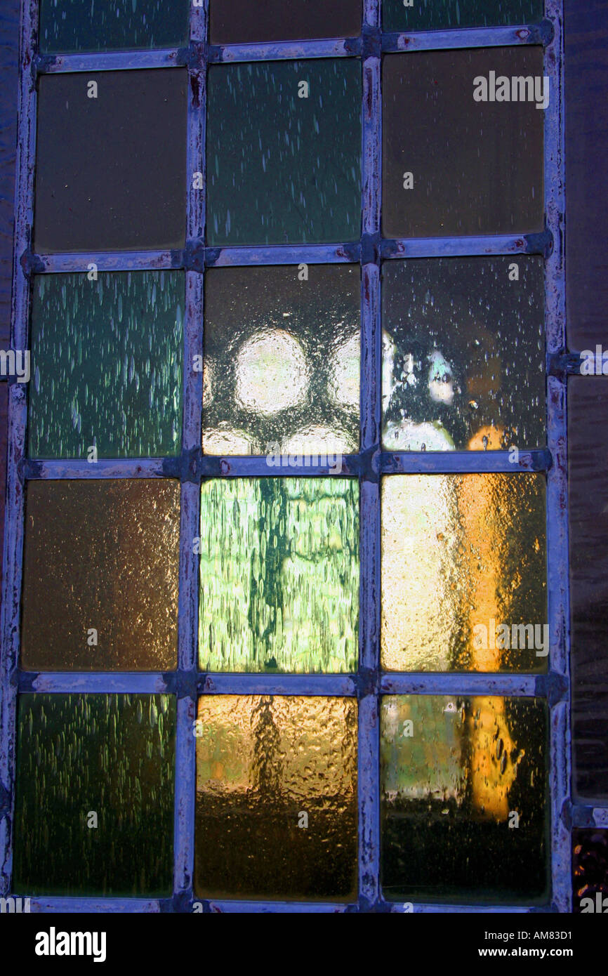 Reflection on old coloured glass of church window Stock Photo - Alamy