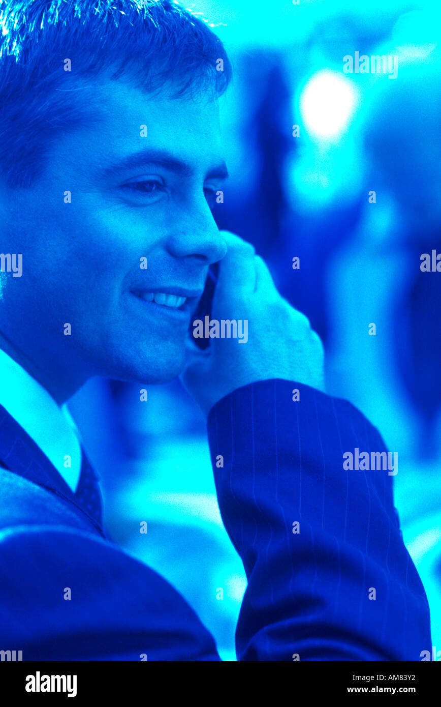 Smiling man using cellphone hi-res stock photography and images - Alamy