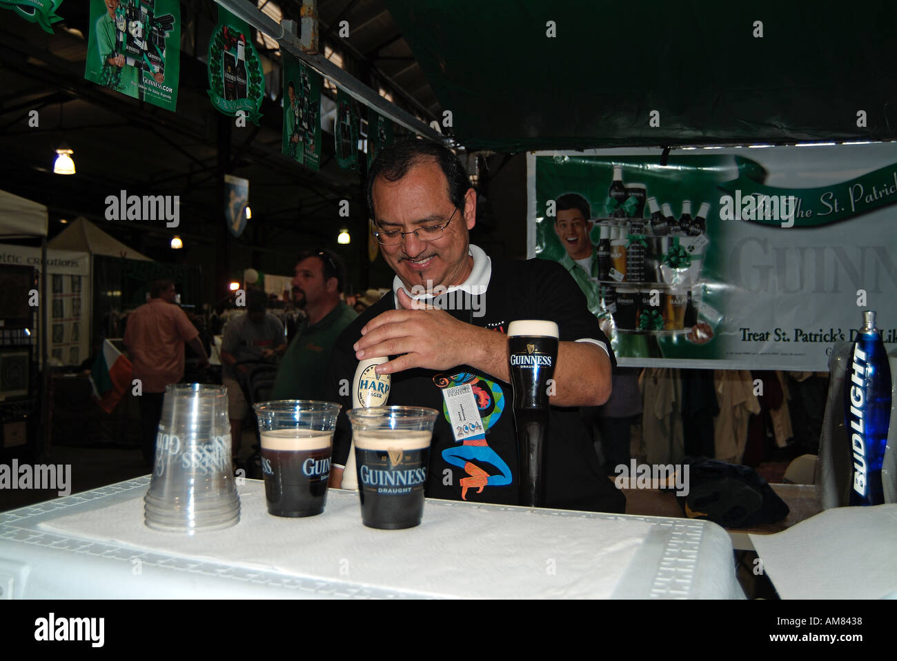 Waiter serving a Guinness draft beer in a booth Stock Photo - Alamy