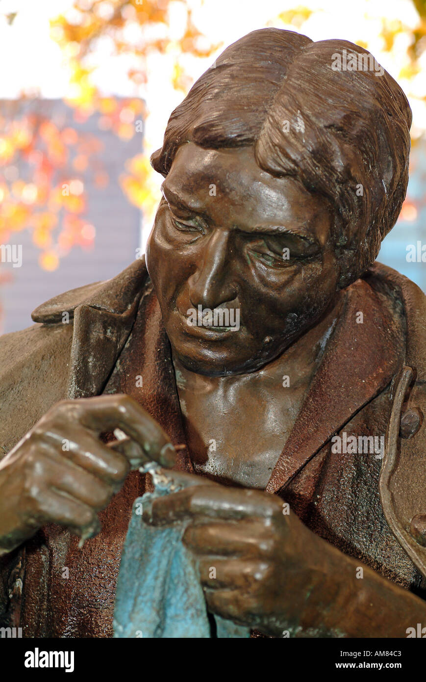 Statue of an old woman knitting in a bench, Dallas downtown Stock Photo ...