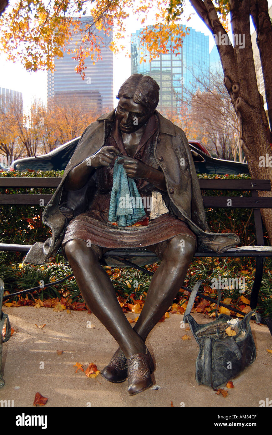 Statue of an old woman knitting in a bench, Dallas downtown Stock Photo ...