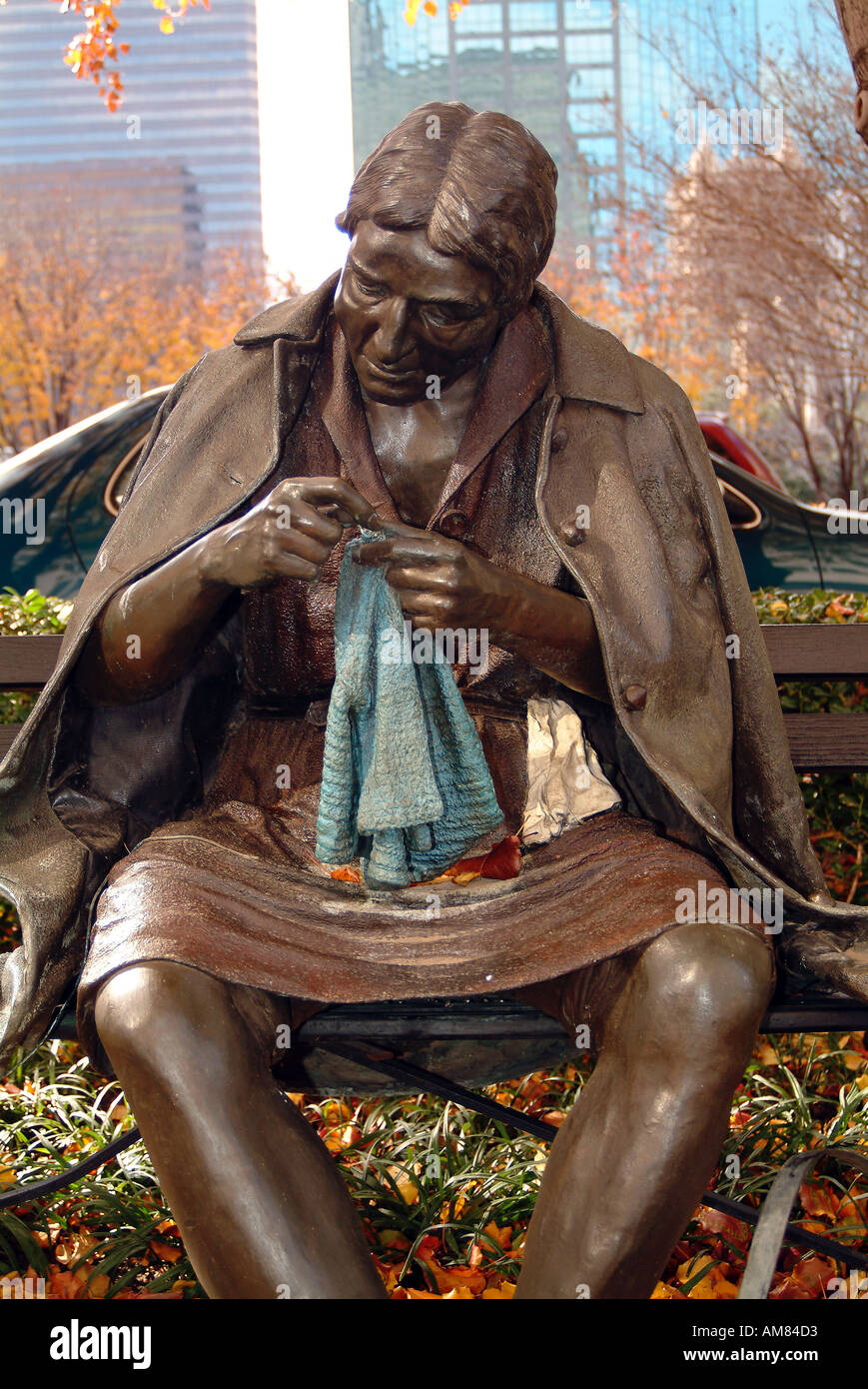 Statue of an old woman knitting in a bench, Dallas downtown Stock Photo ...