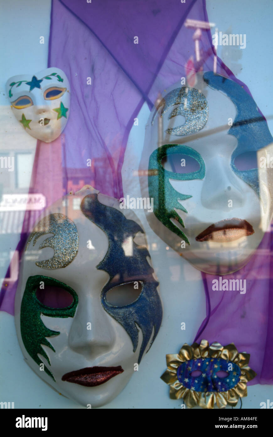 Masks displayed in a shop window Stock Photo - Alamy