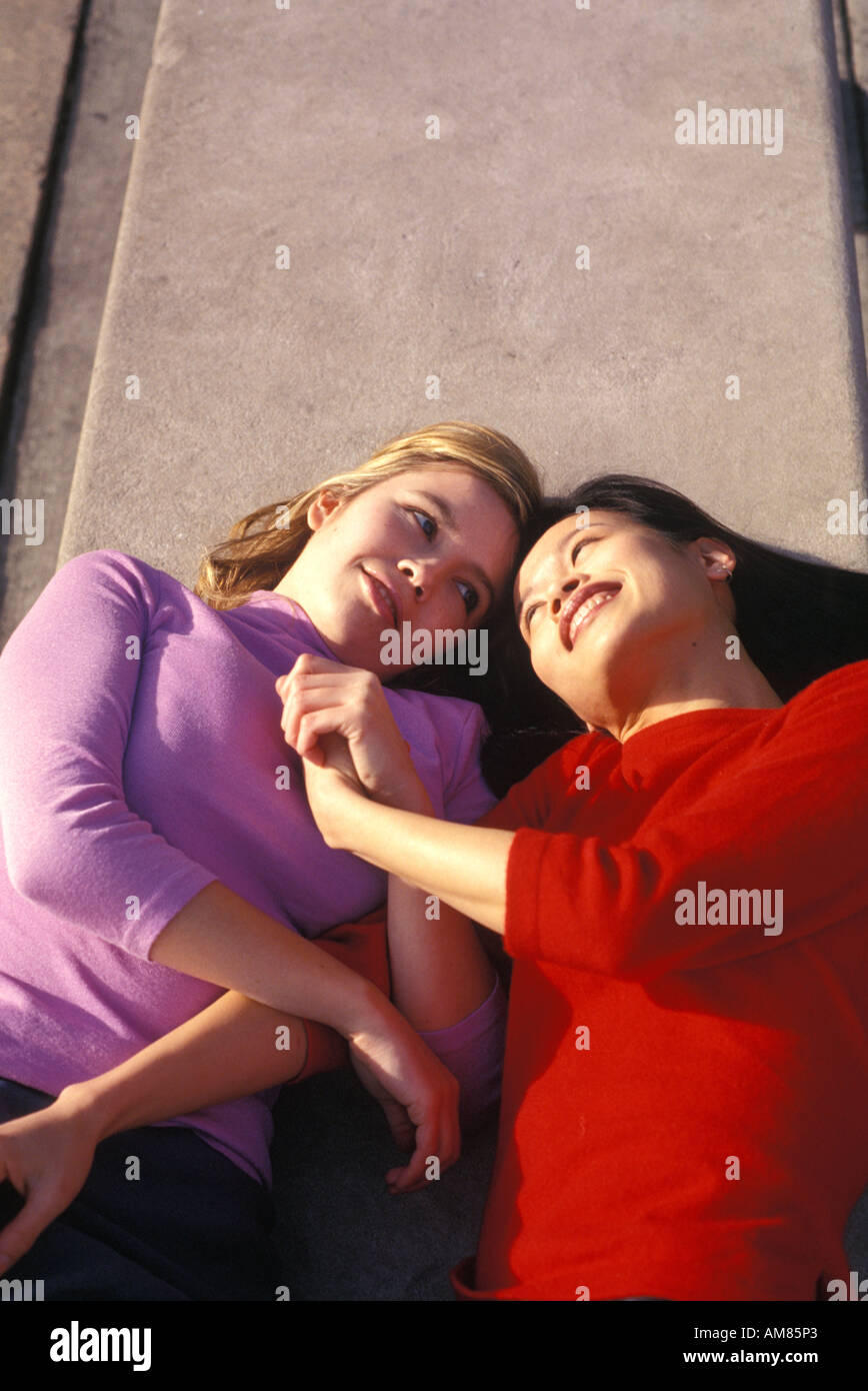 Young women smiling Stock Photo - Alamy