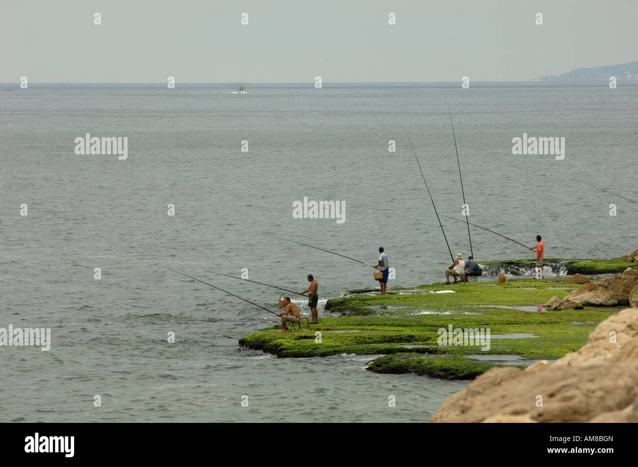 people fishing in the sea Stock Photo - Alamy