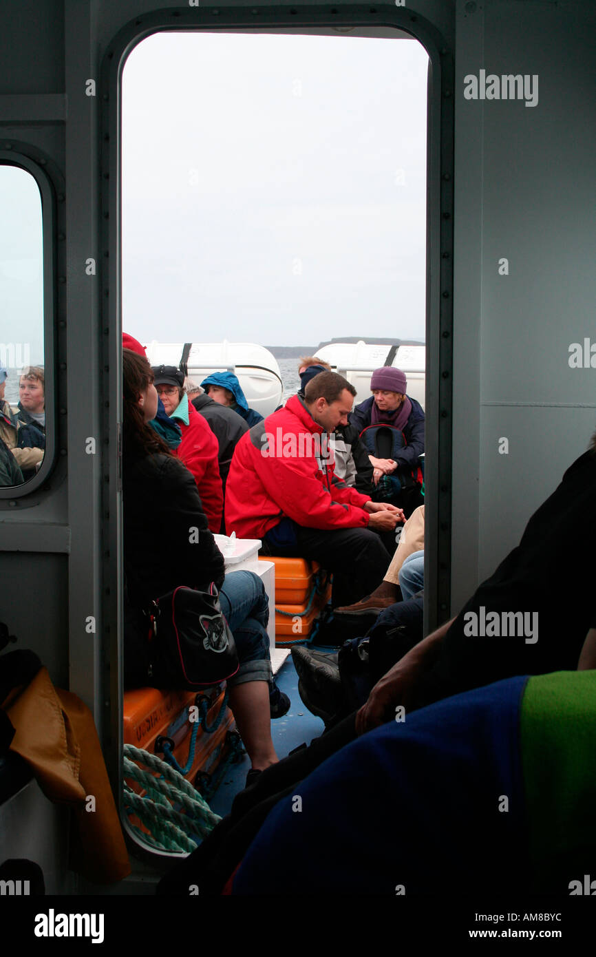 Tourists on a boat trip to Fingal’s Cave, Staffa, Lunga, Treshnish ...