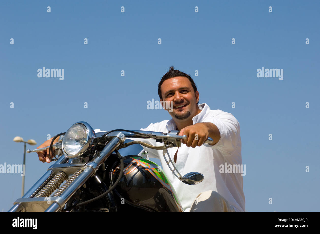 Man riding a motorbike Stock Photo - Alamy