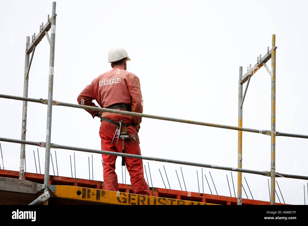 A worker has a break at a construction site for a new office building ...