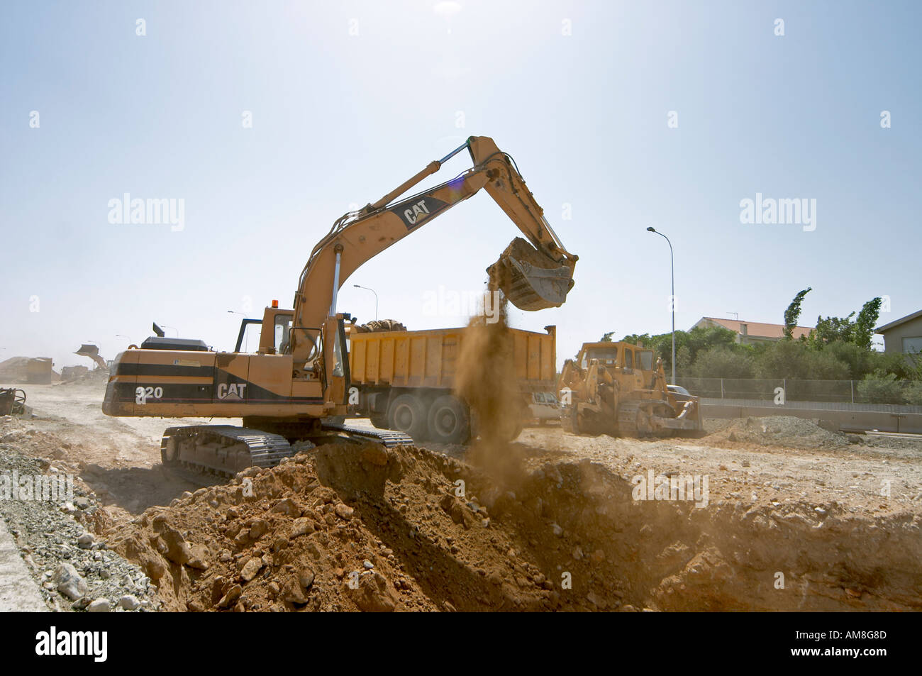Excavator and dump truck Civil Engineering plant on Road construction ...