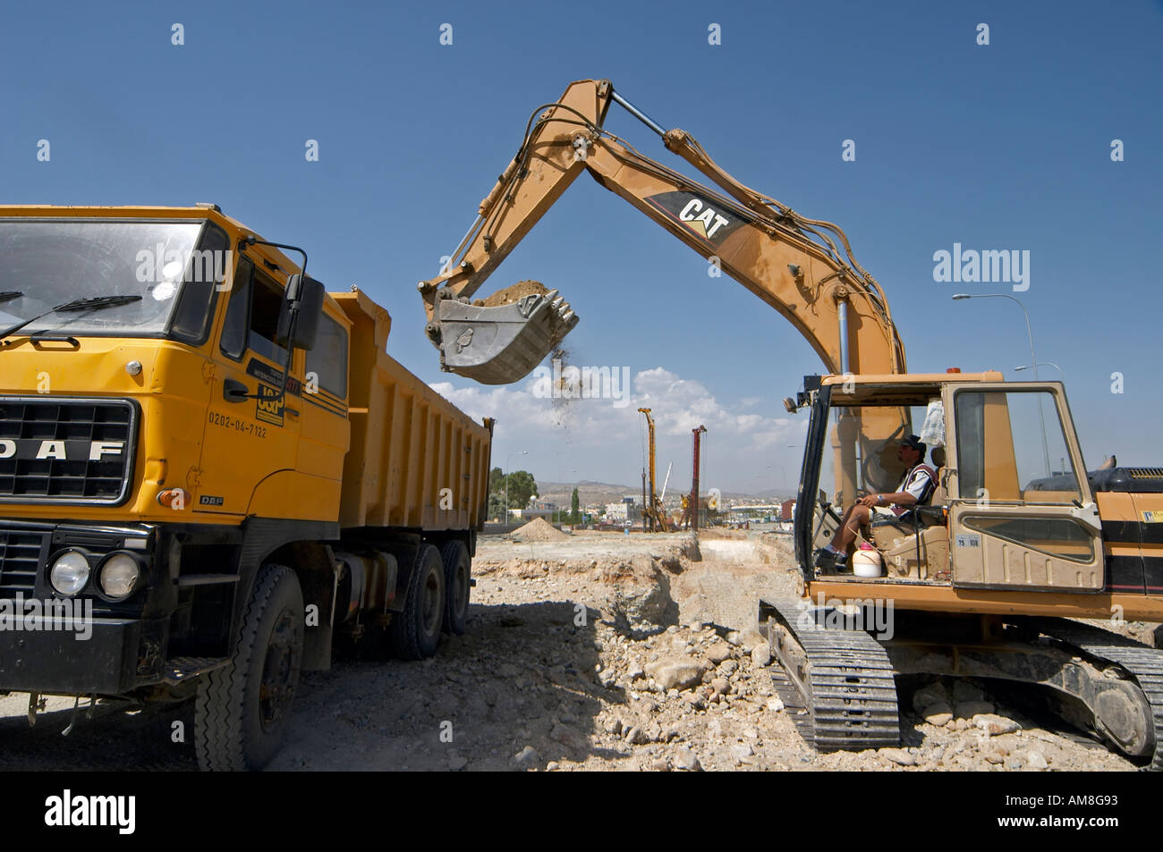 Excavator and dump truck Civil Engineering plant on Road construction ...