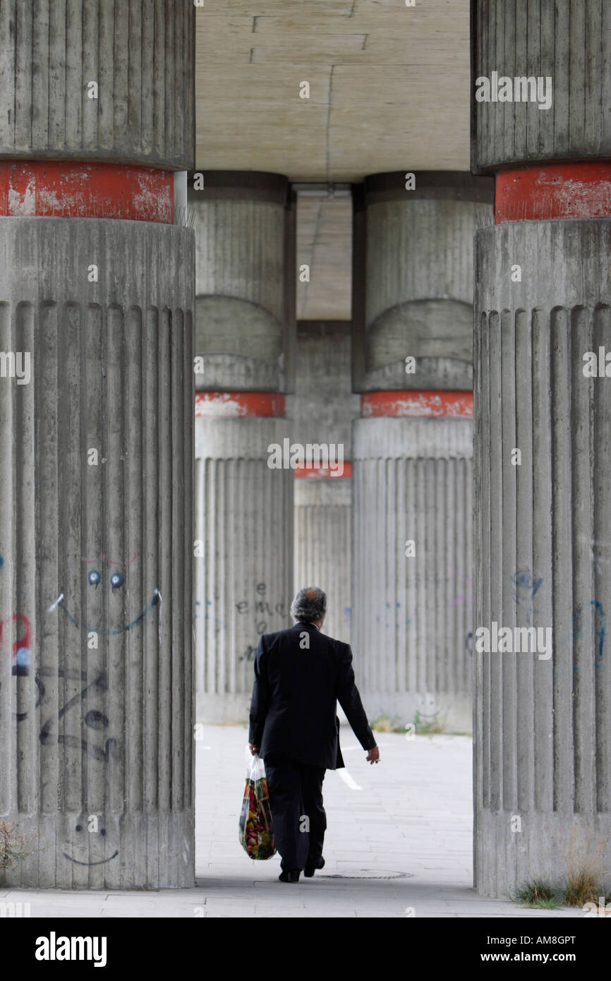 Man walks between columns of a subway bridge in Hamburg, Germany Stock ...
