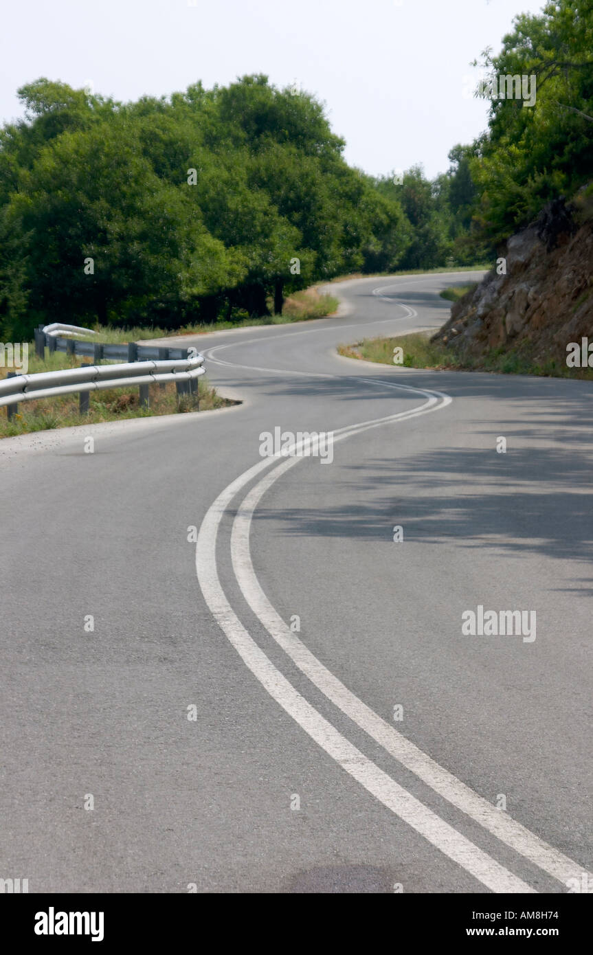 Curved winding road receding into distance Olympus region Greece Stock ...