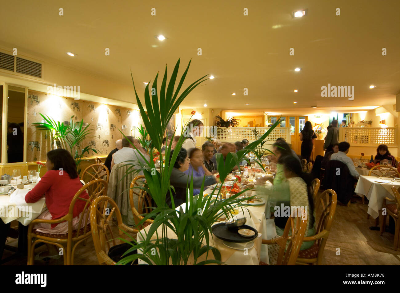 Diners and waiters in Haandi Indian Restaurant London SW3 Stock Photo ...
