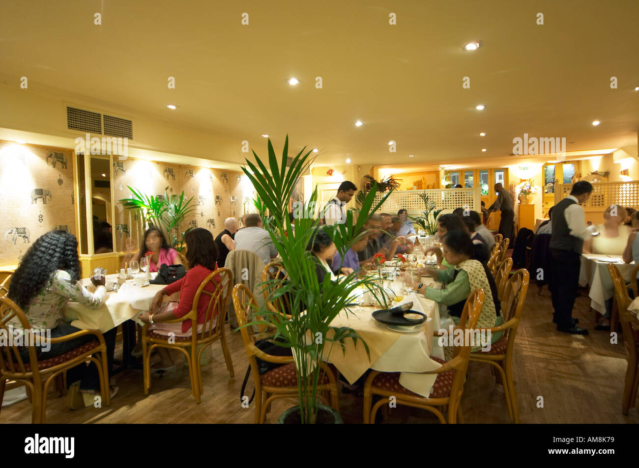 Diners and waiters in Haandi Indian Restaurant London SW3 Stock Photo ...