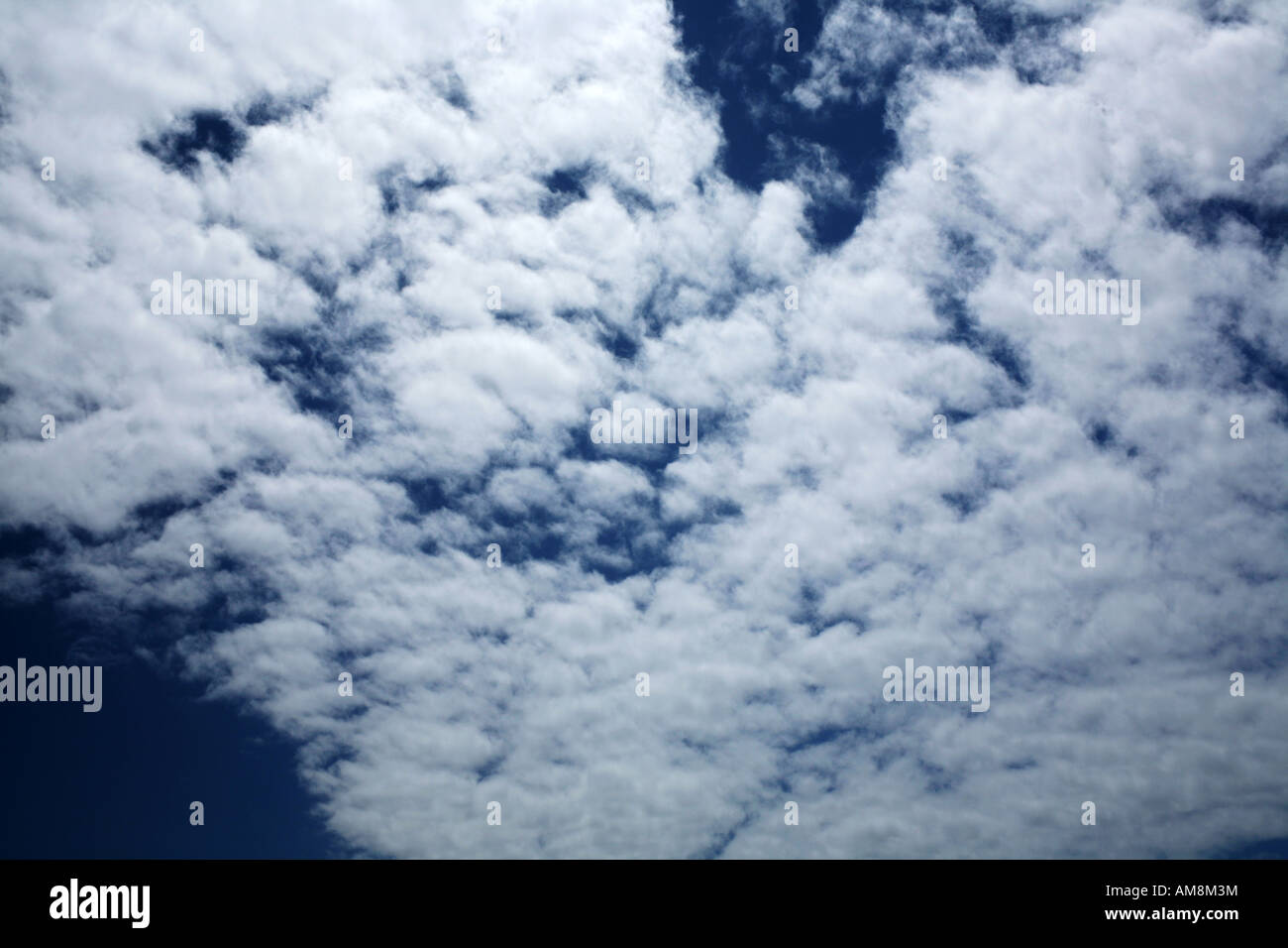 Blue sky with some cloud formations Stock Photo - Alamy